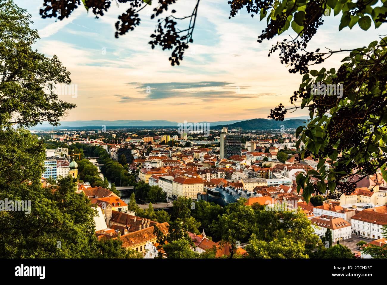 View at Graz city with his famous buildings. River mur, clock tower ...