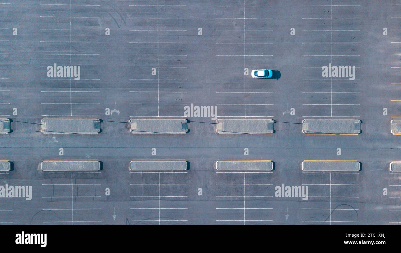 There is one car in the large parking lot. View from a drone Stock ...