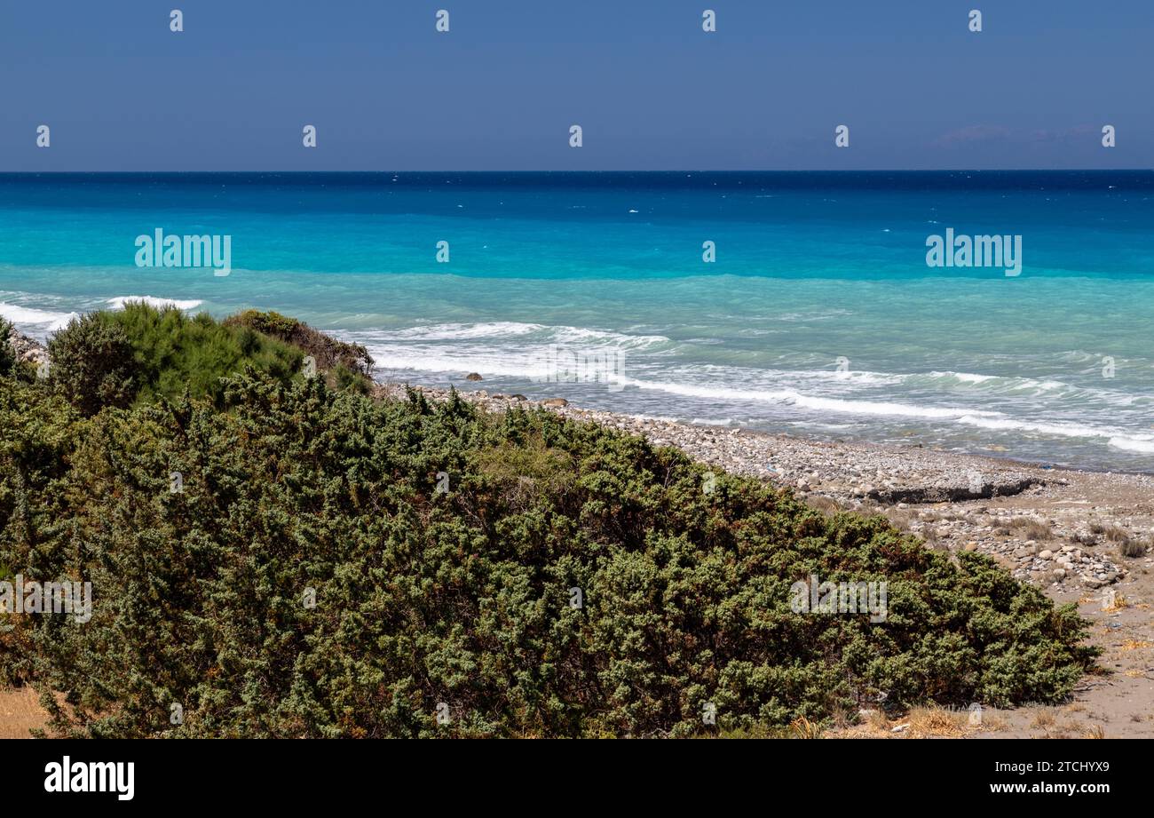 Pebble beach at the southwest coast of Rhodes island near Apolakkia ...