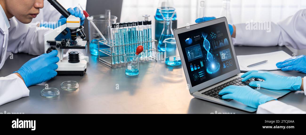 Dedicated scientist group working on advance biotechnology computer ...