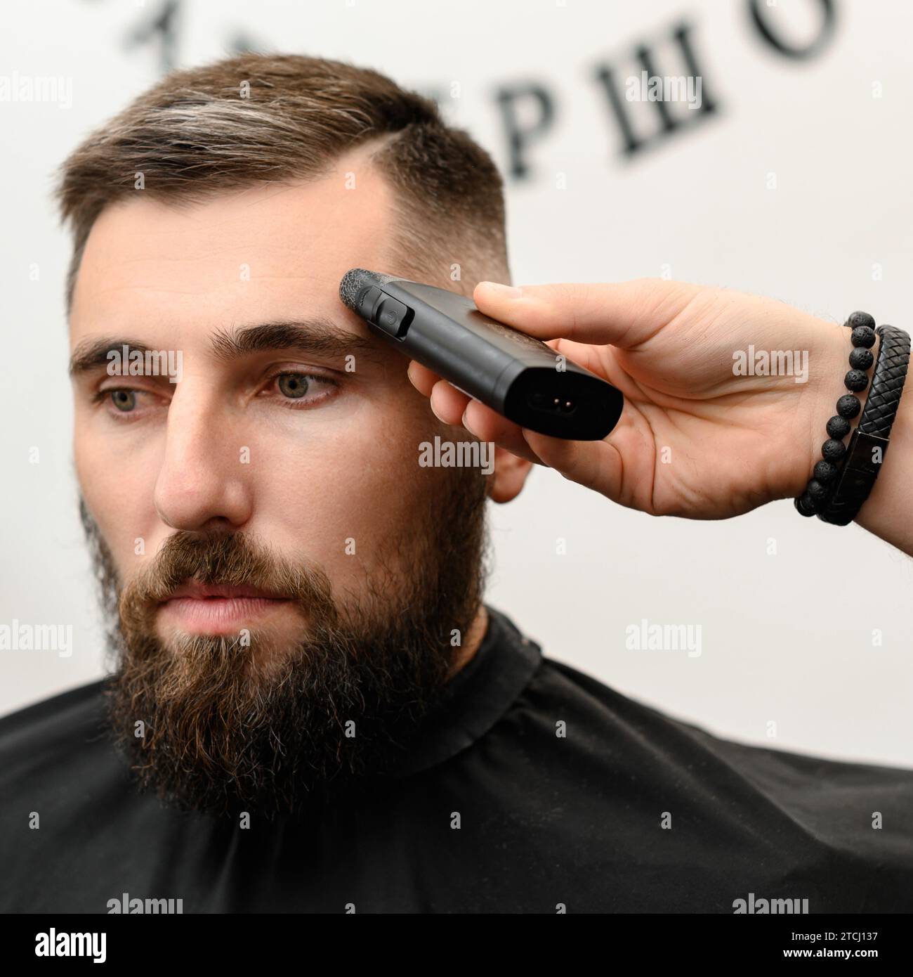 Barber shaves temple cordless trimmer hi-res stock photography and ...
