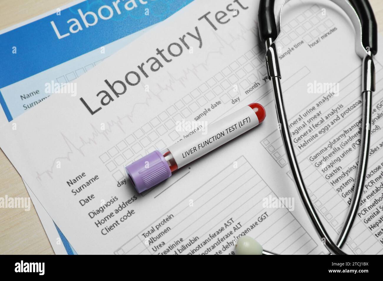 Liver Function Test. Tube with blood sample, stethoscope and laboratory ...
