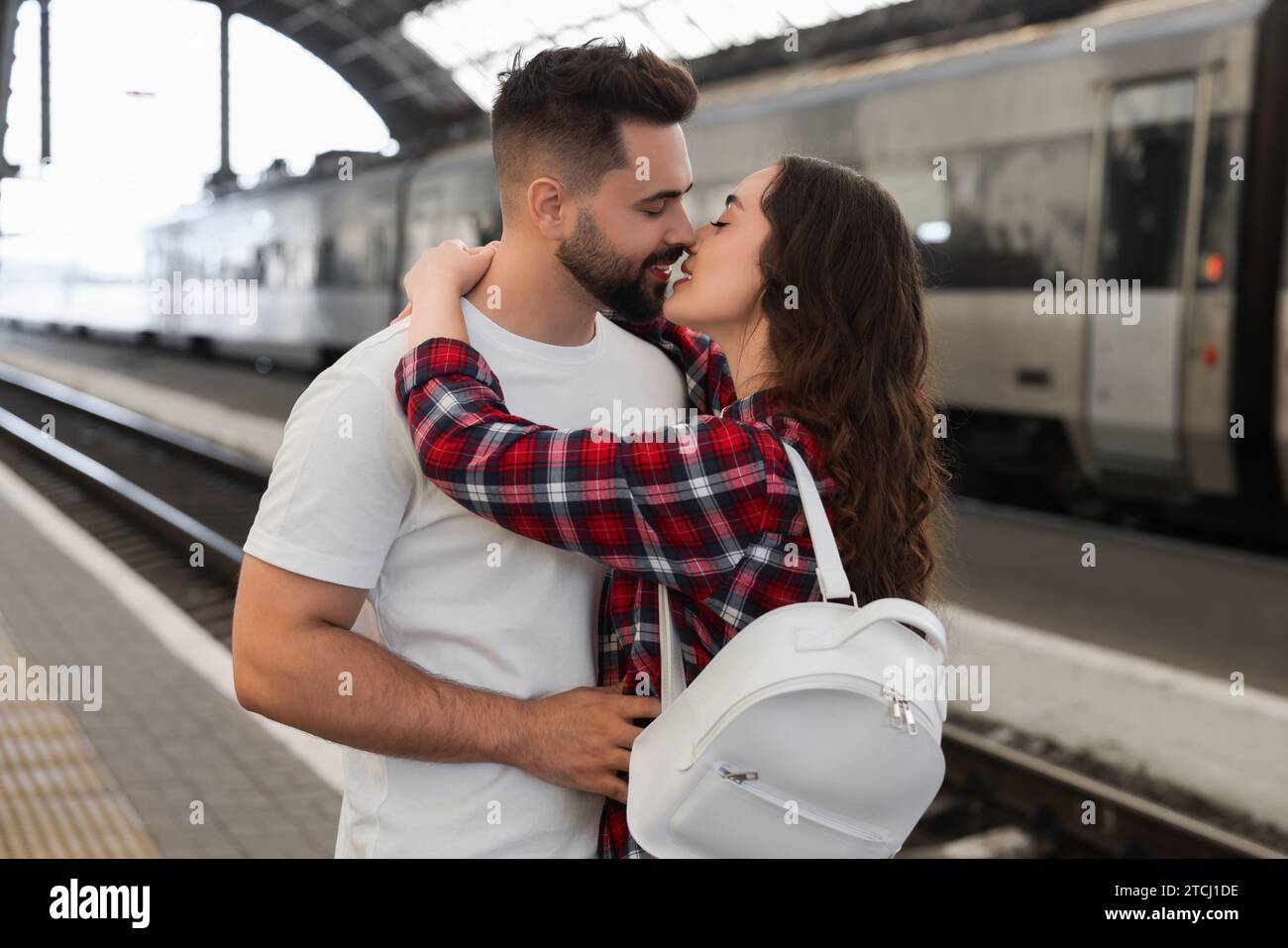Long-distance relationship. Beautiful couple on platform of railway station Stock Photo - Alamy