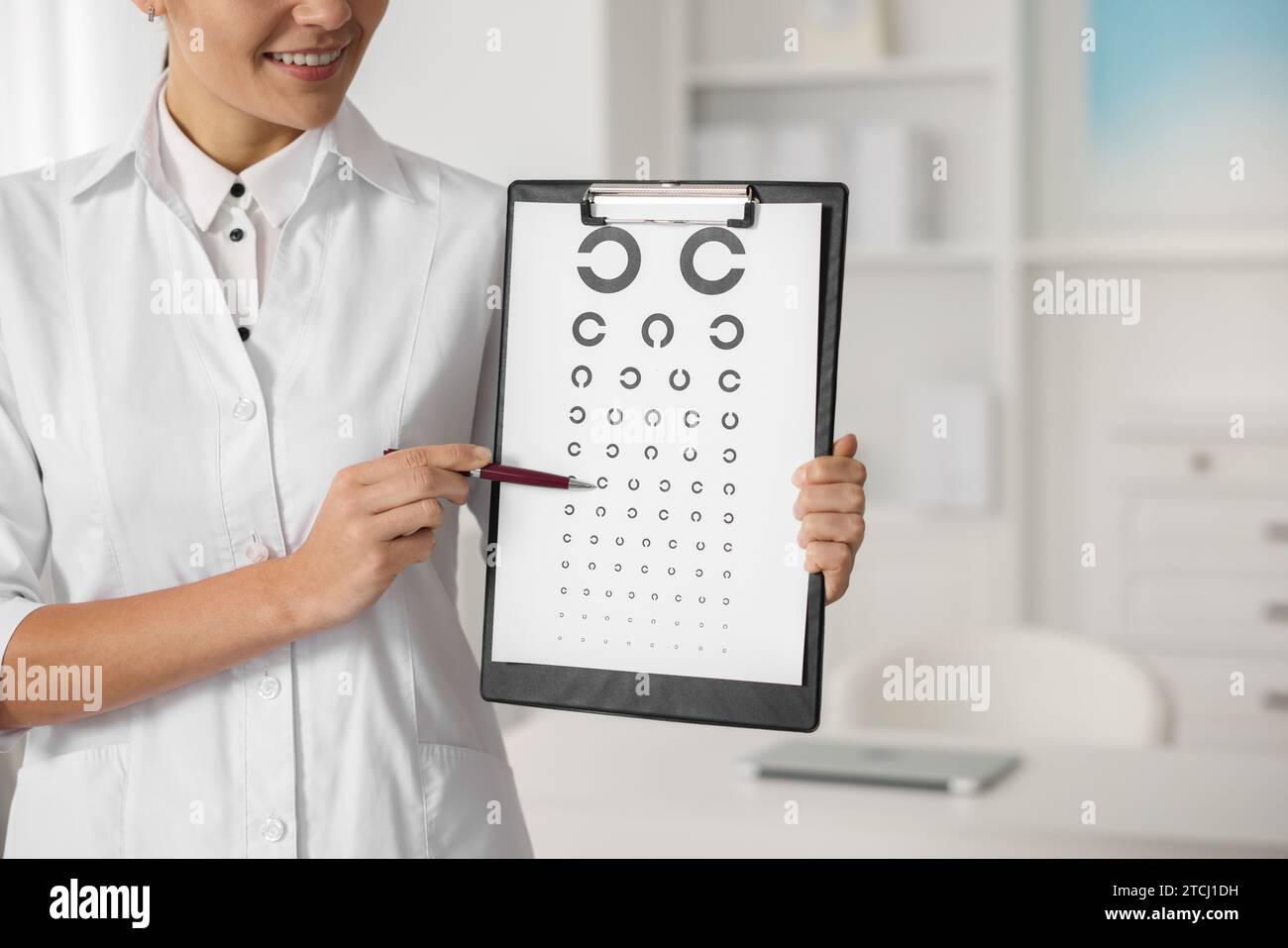 Ophthalmologist pointing at vision test chart in clinic, closeup Stock ...
