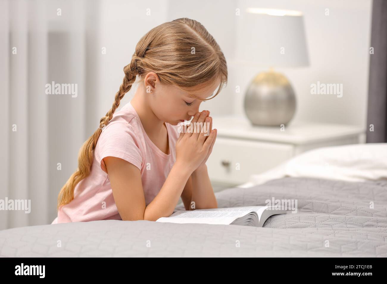 Girl praying hands in hi-res stock photography and images - Alamy