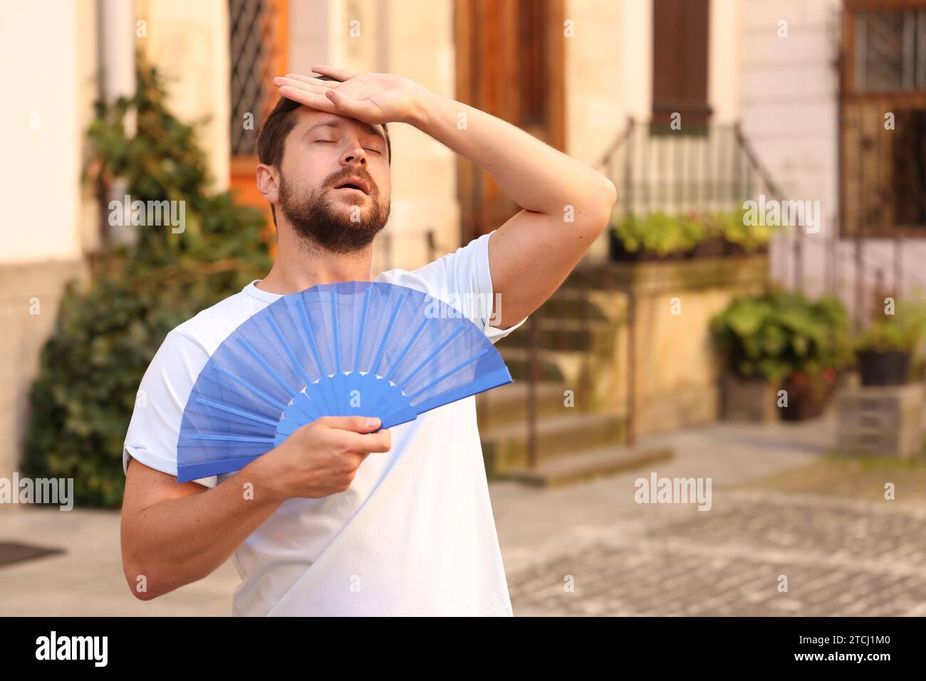 Man sweating from summer heat hi-res stock photography and images - Alamy