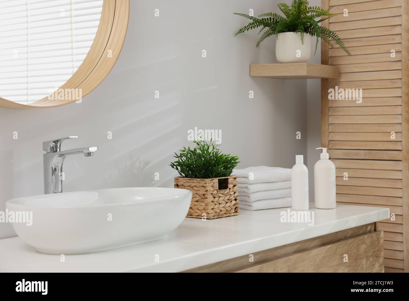 Different potted artificial plants in bathroom. Home decor Stock Photo ...