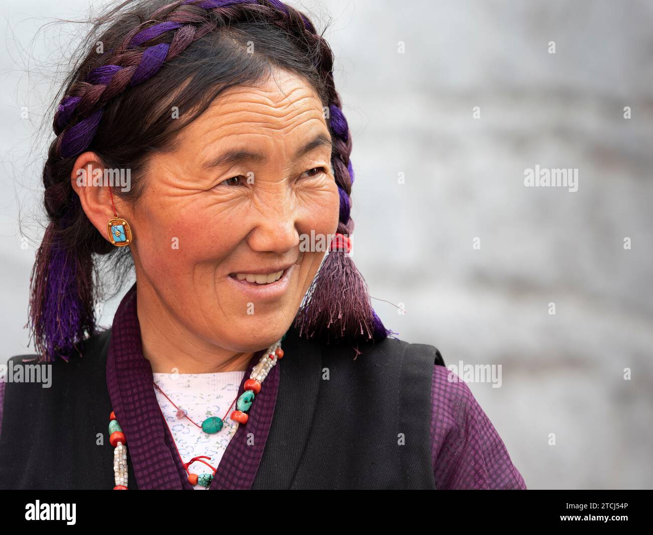 Tibetan woman with braid, laughing, pilgrim in Xigaze, Tibet, China ...
