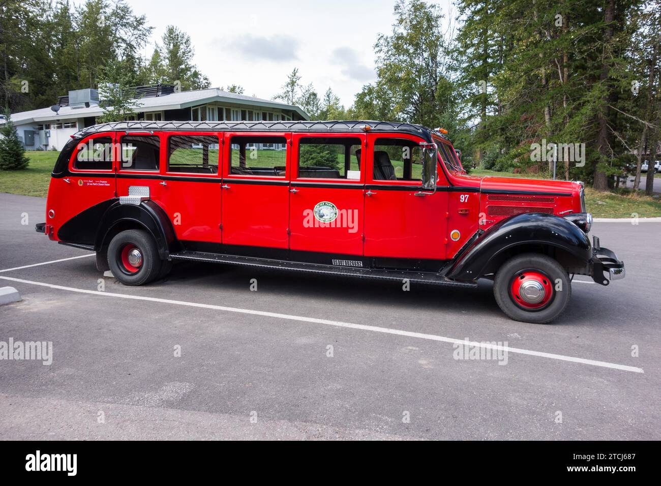 Red Bus in Glacier National Park Montana Stock Photo - Alamy