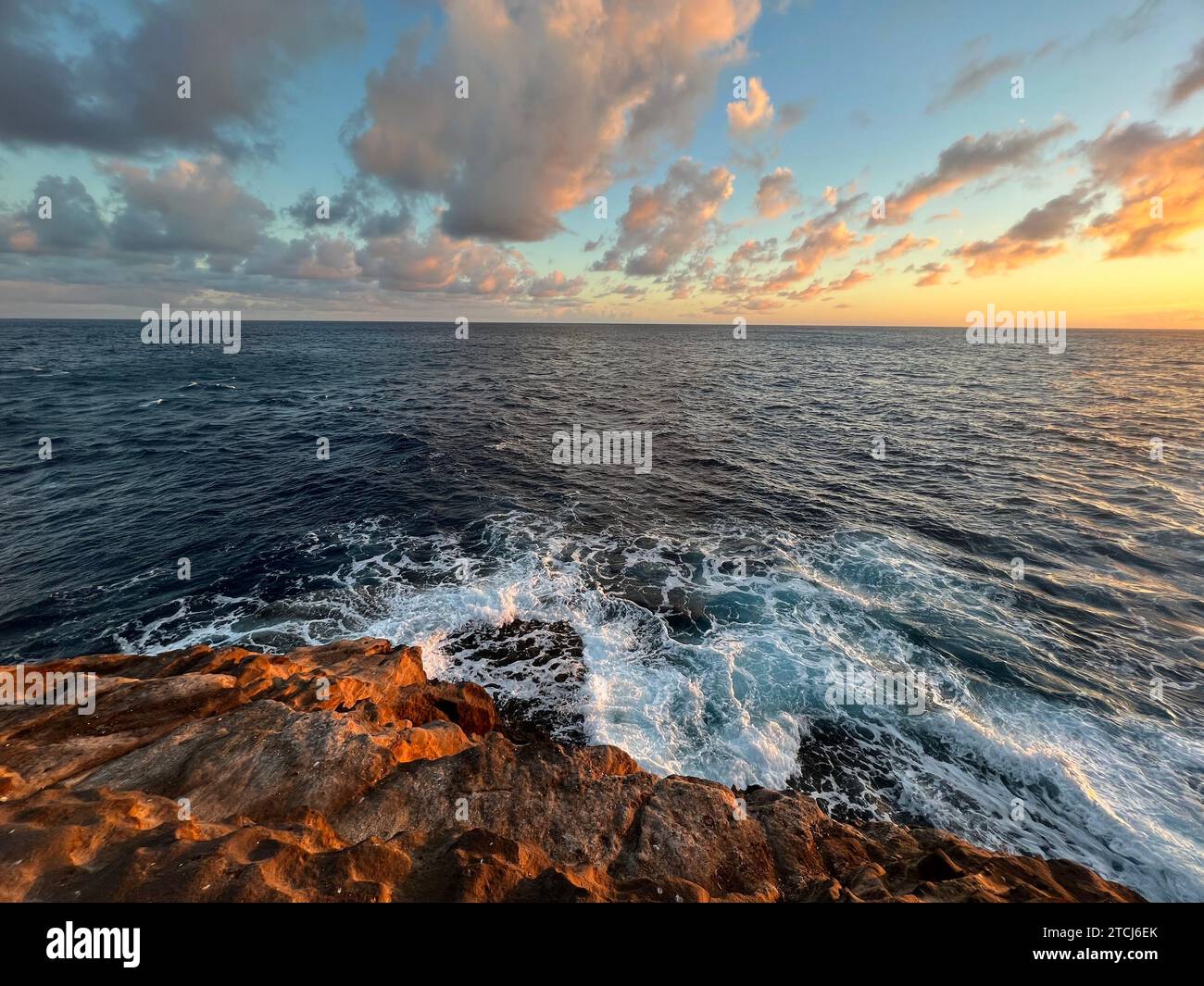 A tranquil body of water is pictured, with calm waters lapping against ...