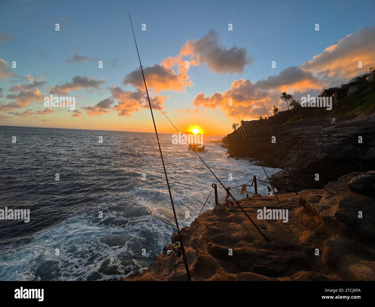 A small group of people are enjoying a leisurely fishing activity from ...