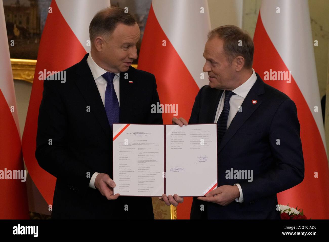 Poland's new Prime Minister Donald Tusk, right, and Poland's President Andrzej Duda pose for ...