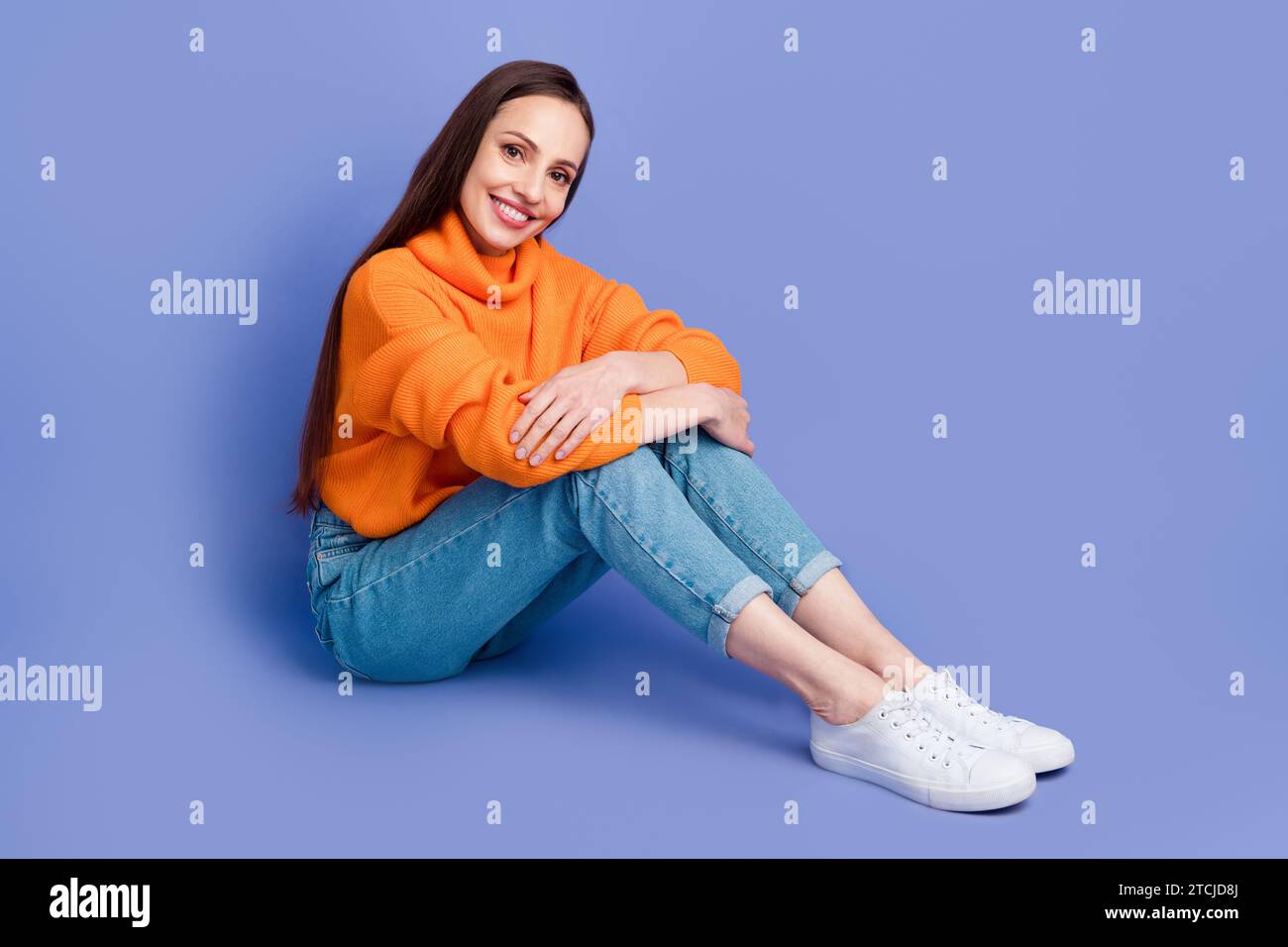 Full body photo of optimistic lovely lady sitting on floor comfortable ...