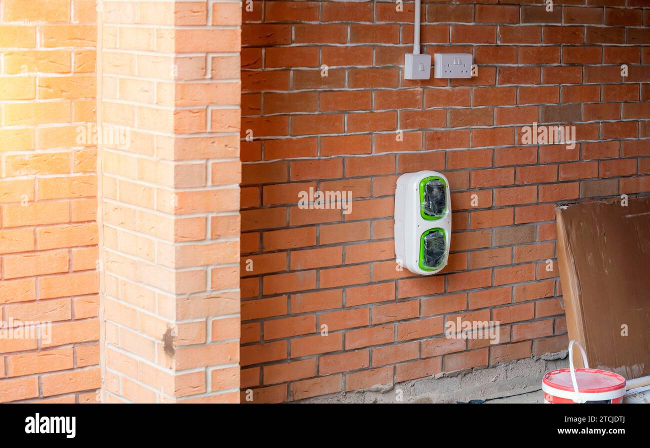 Electric vehicle domestic charging point installed outside of the house ...