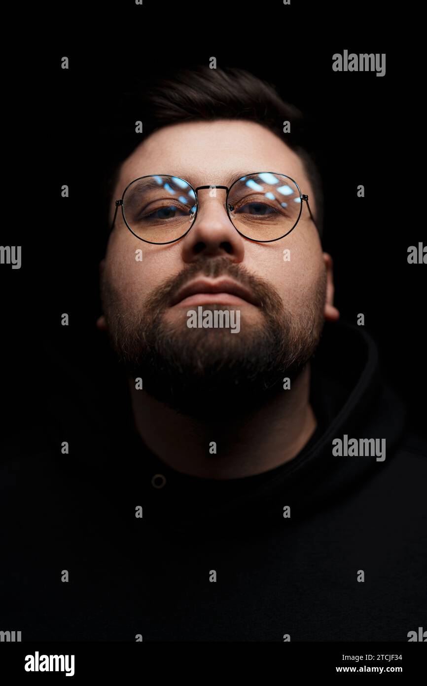 Contemplative Man with Glasses Stock Photo - Alamy