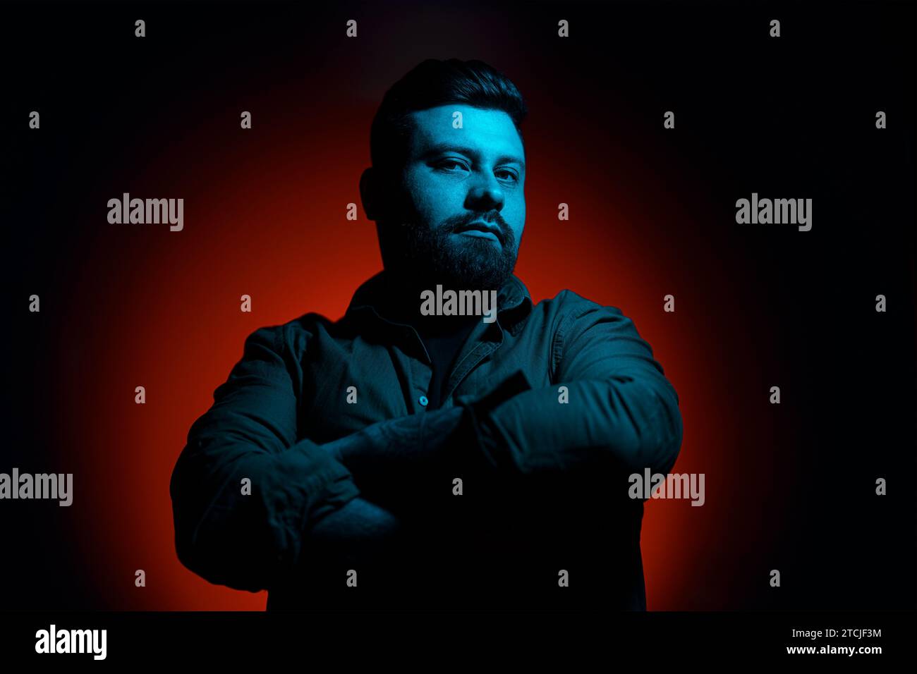Confident Man in Dramatic Red and Blue Light Stock Photo - Alamy