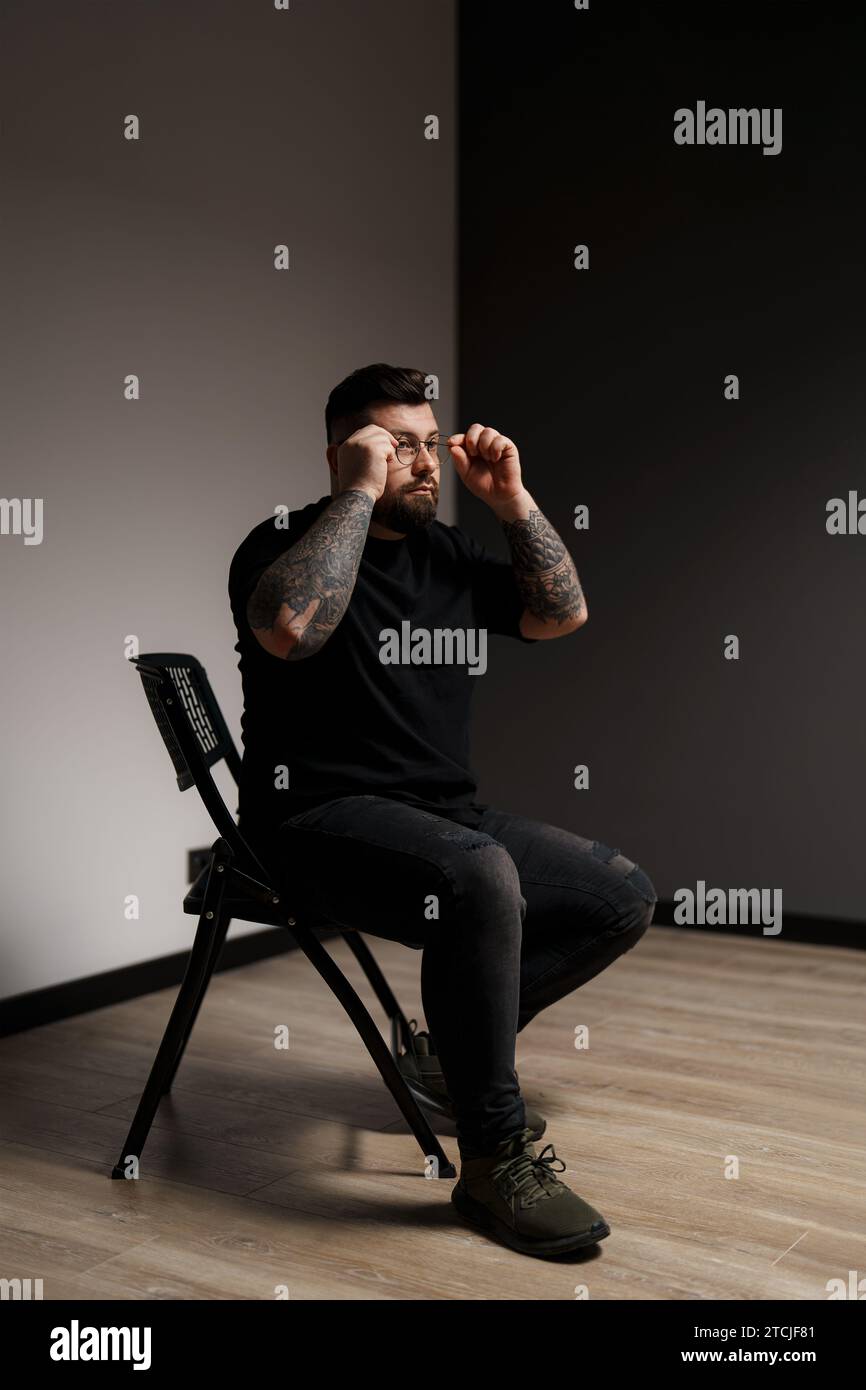 Young man glasses tattooed hi-res stock photography and images - Alamy