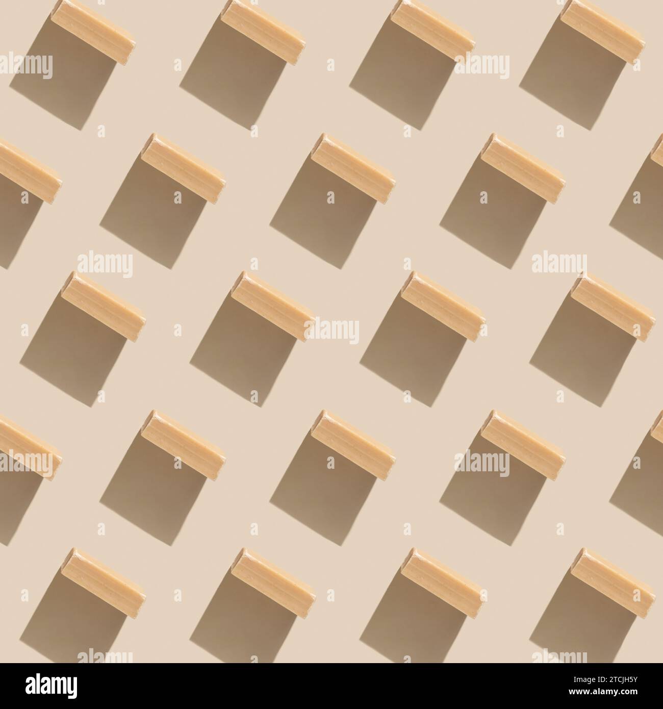 Patern with natural herbal beige soap bars on light beige top view ...