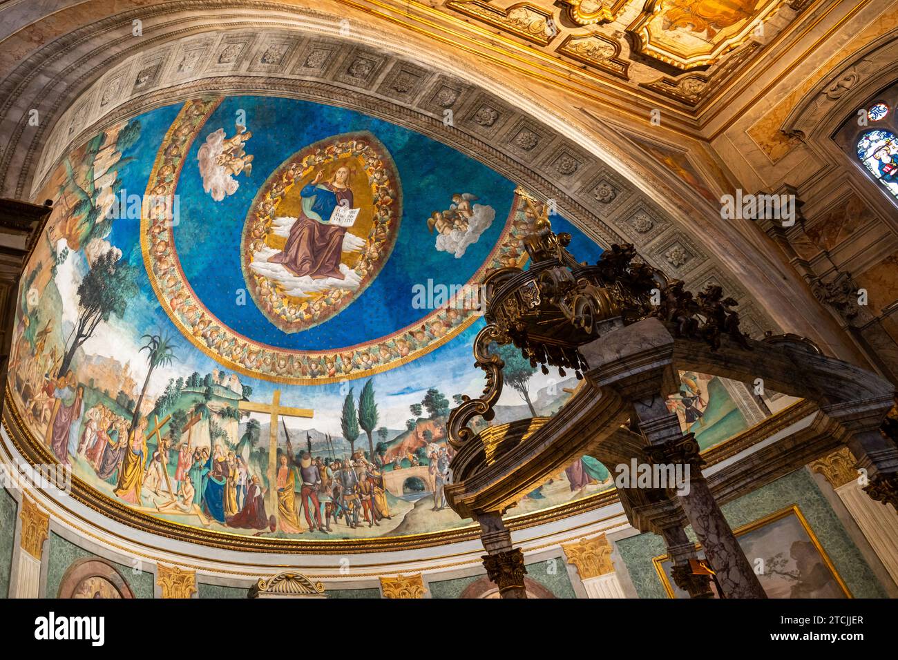 View of colorful religious fresco decorating an arch ceiling inside ...