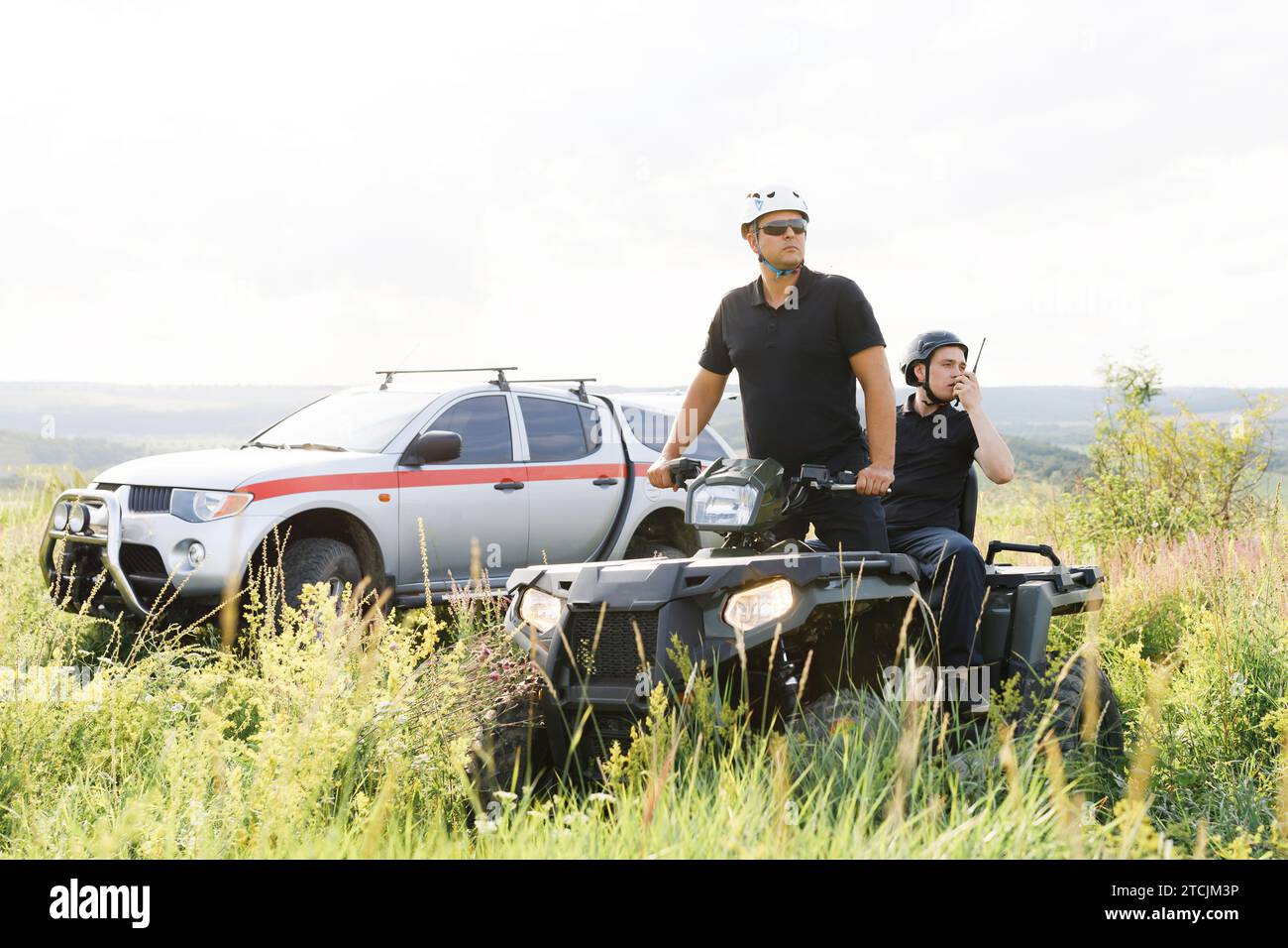 Rescuers on an ATV in the middle of the field, rescue vehicles Stock ...