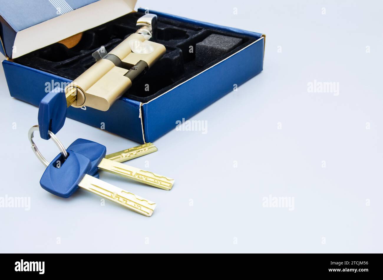 New door lock in packaging. Patent and keys to the front door. Contact ...