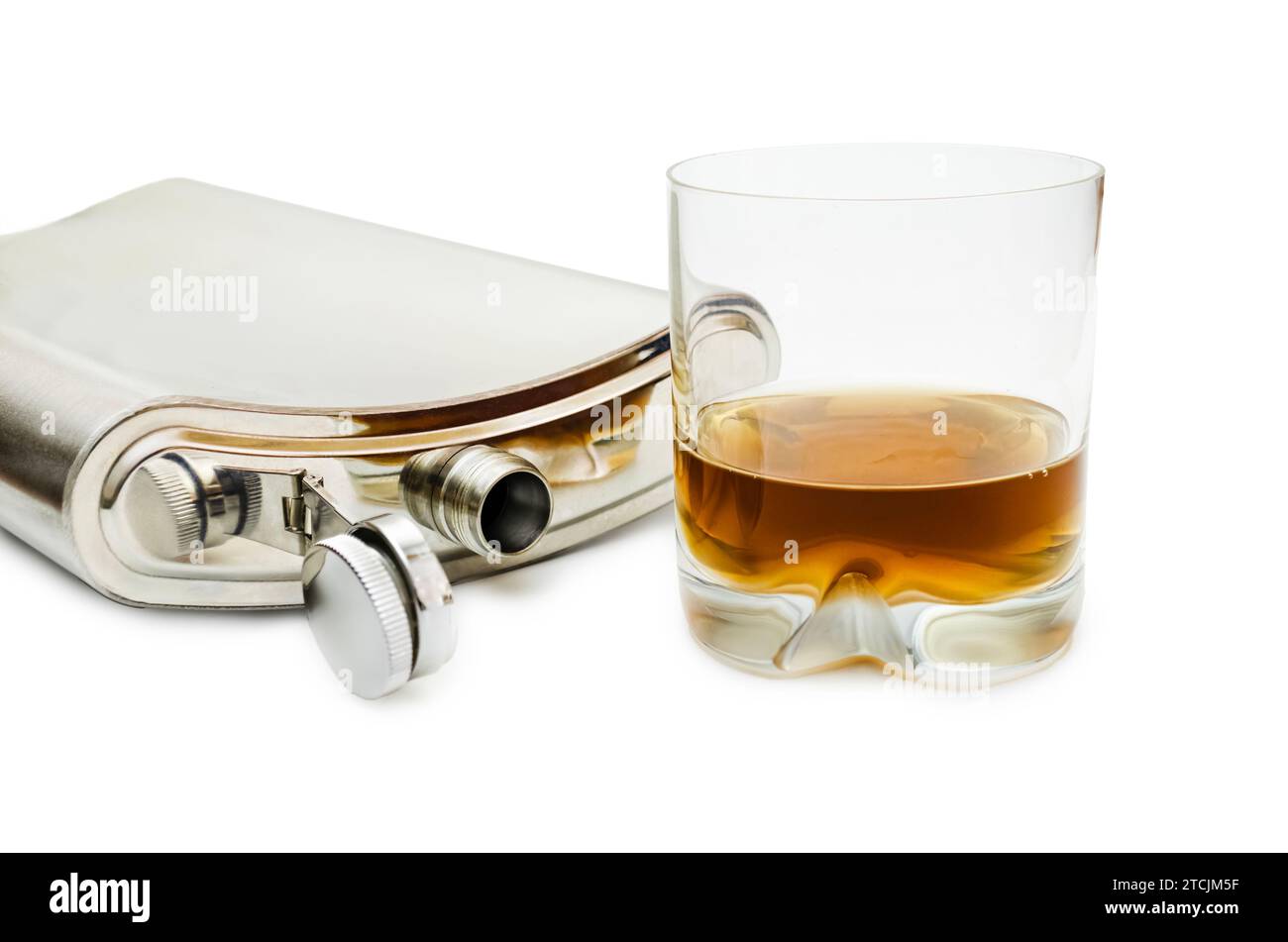 Close-up of a silver metal flask and a glass with liquid, alcoholic ...