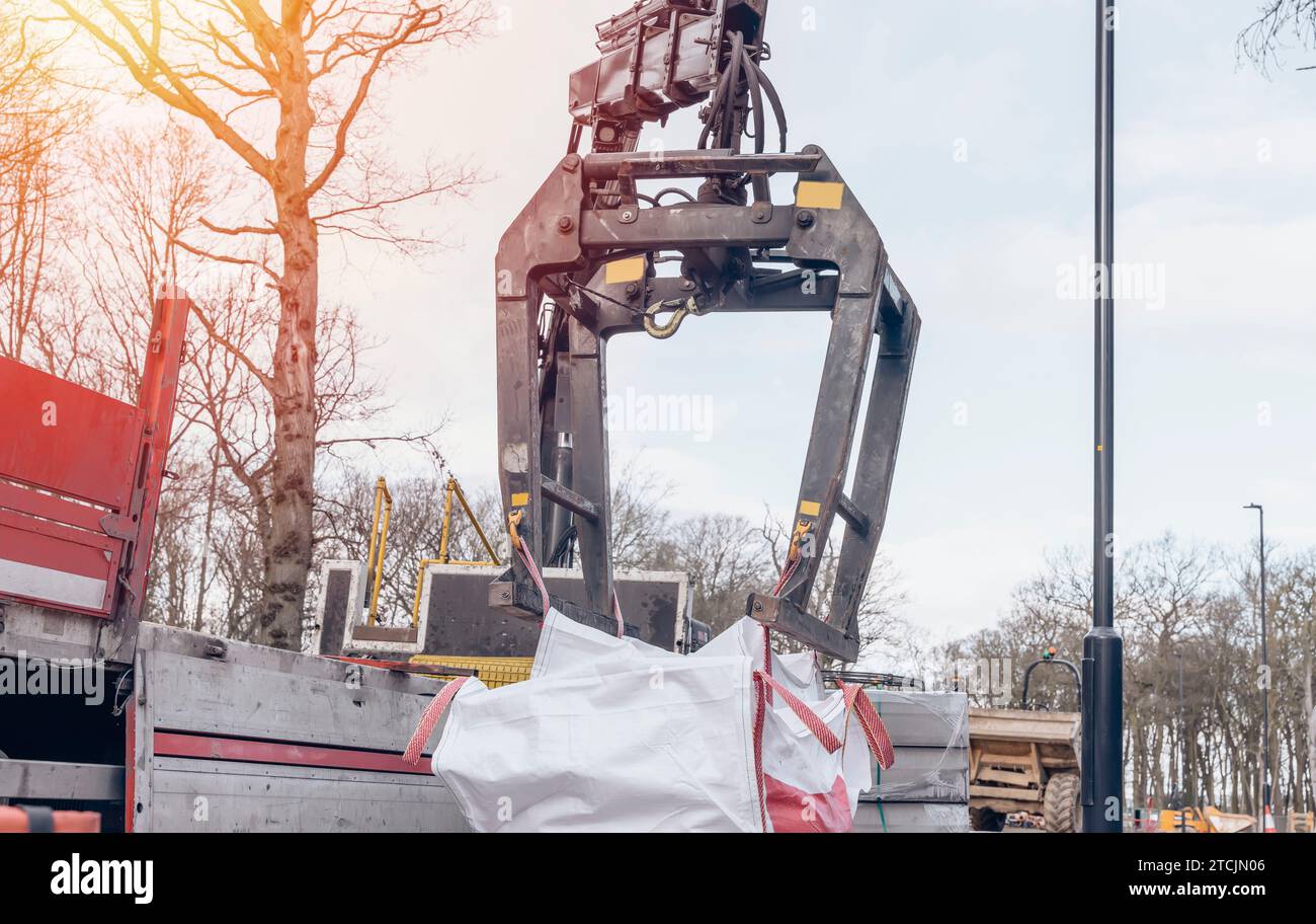 Dropside flatbed HIAB crane lorry with brick grab attachment deliver ...