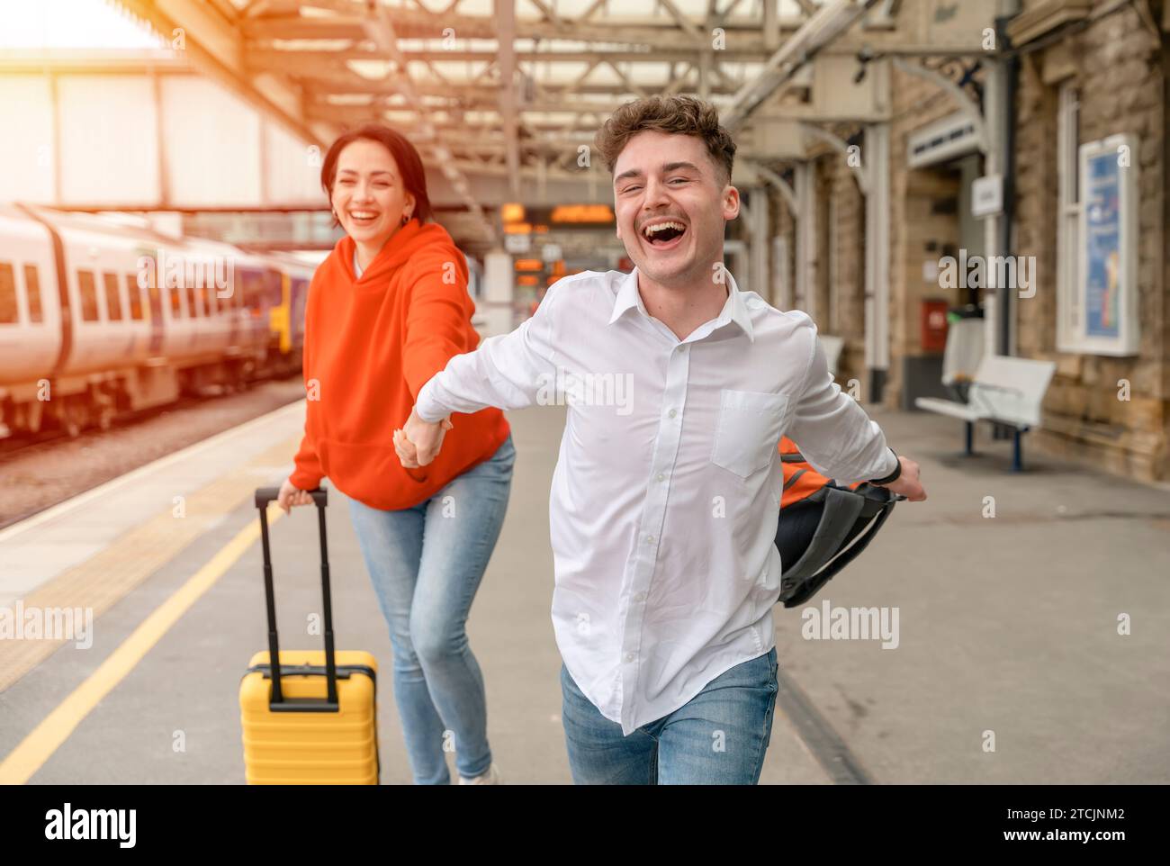 Beautiful couple at railway station waiting for the train. Woman and ...