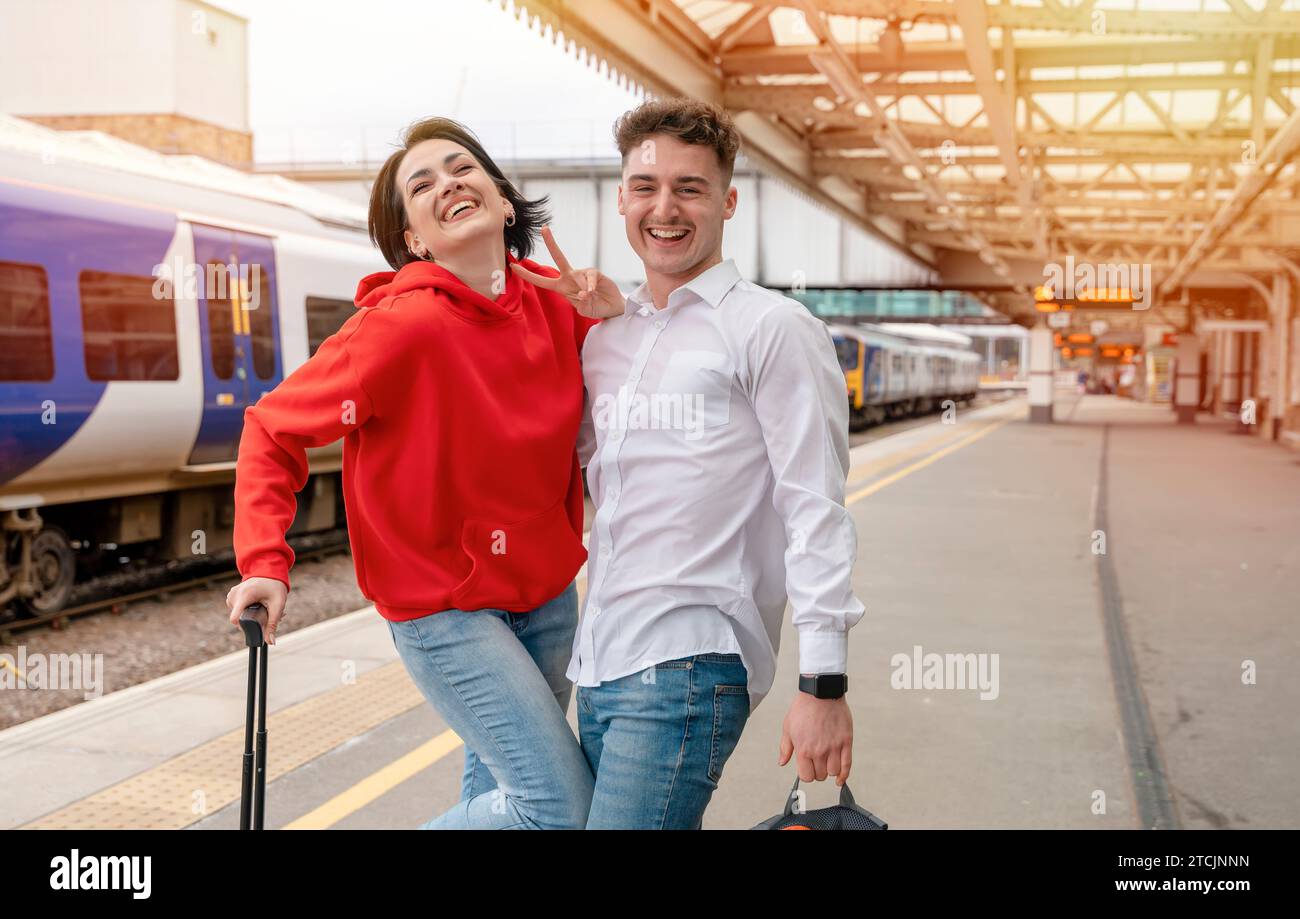 Beautiful couple at railway station waiting for the train. Woman and ...