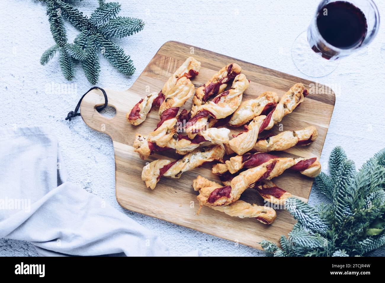 Puff pastry sticks. Close-up of puff pastry with prosciutto Stock Photo ...