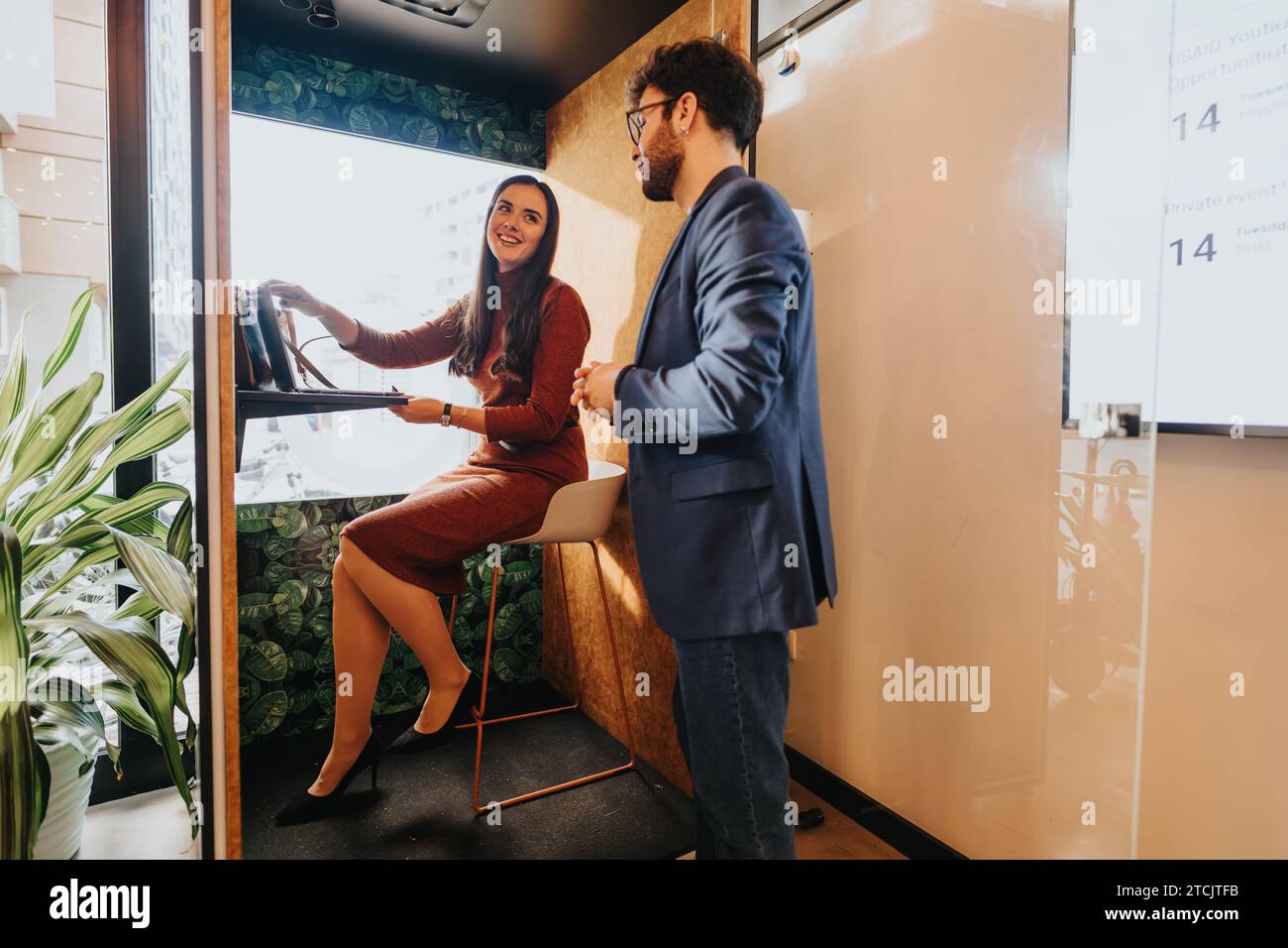 Businesspeople discussing and negotiating projects with clients in an ...