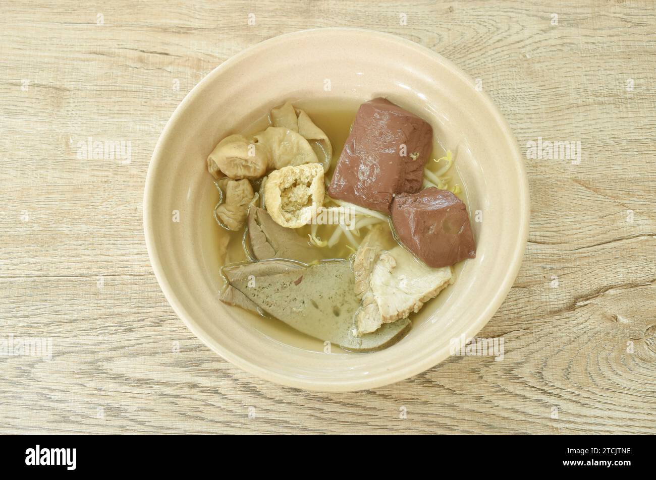 boiled pork blood and entrails with bean sprout in clear soup on bowl ...