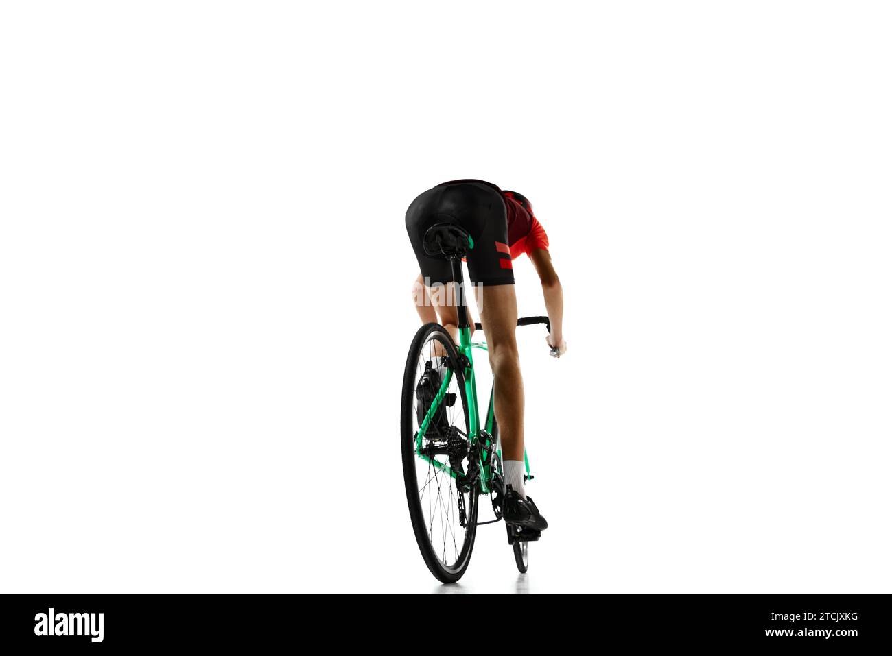 Back view. Young man, cyclist in sportswear and helmet riding bicycle ...
