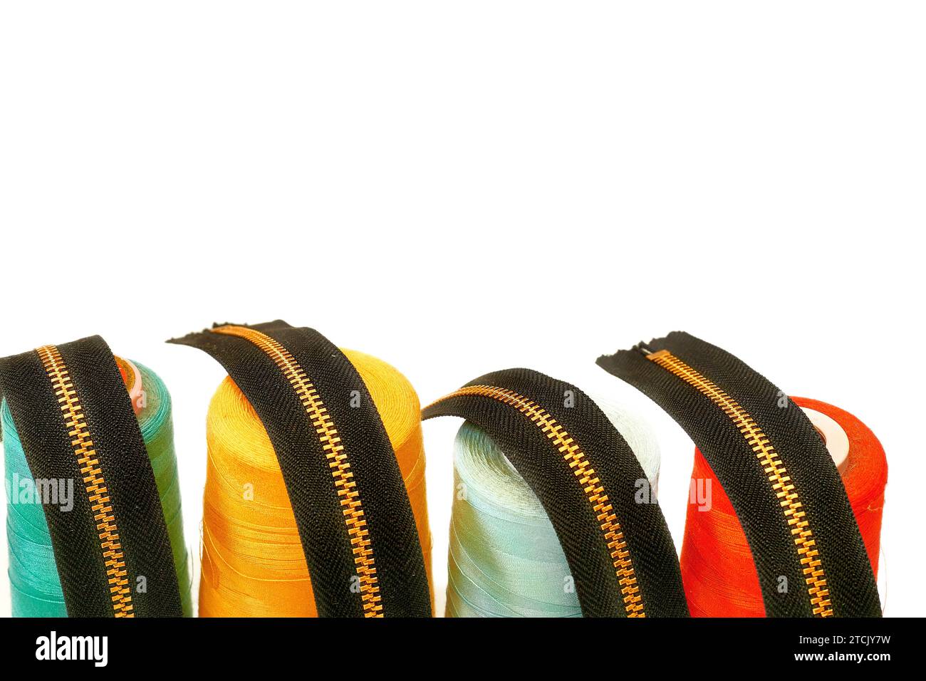 Black zippers for clothes, a spools of different thread Stock Photo - Alamy