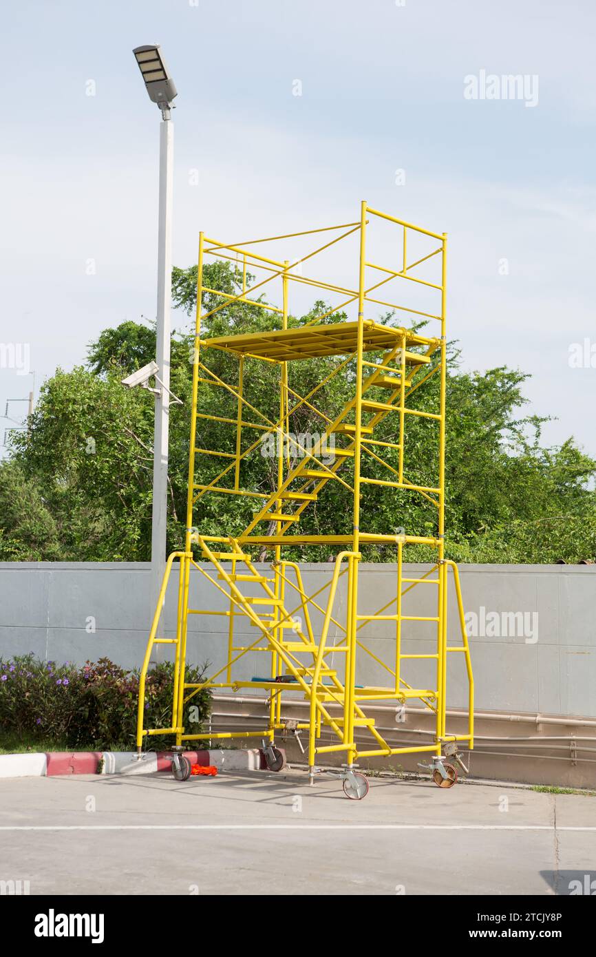 outdoor yellow Scaffolding in construction site with street lamp Stock ...