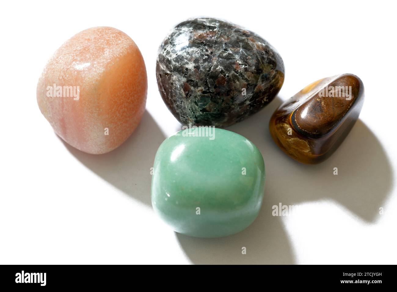 set of polished gemstones on white background Stock Photo - Alamy