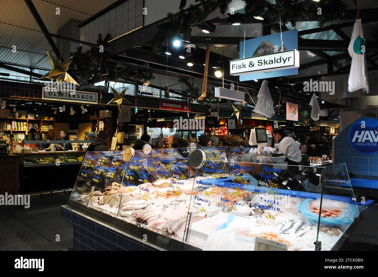 Copenhagen, Denmark /13 December 2023/.Sea food shoppers at fish shop ...