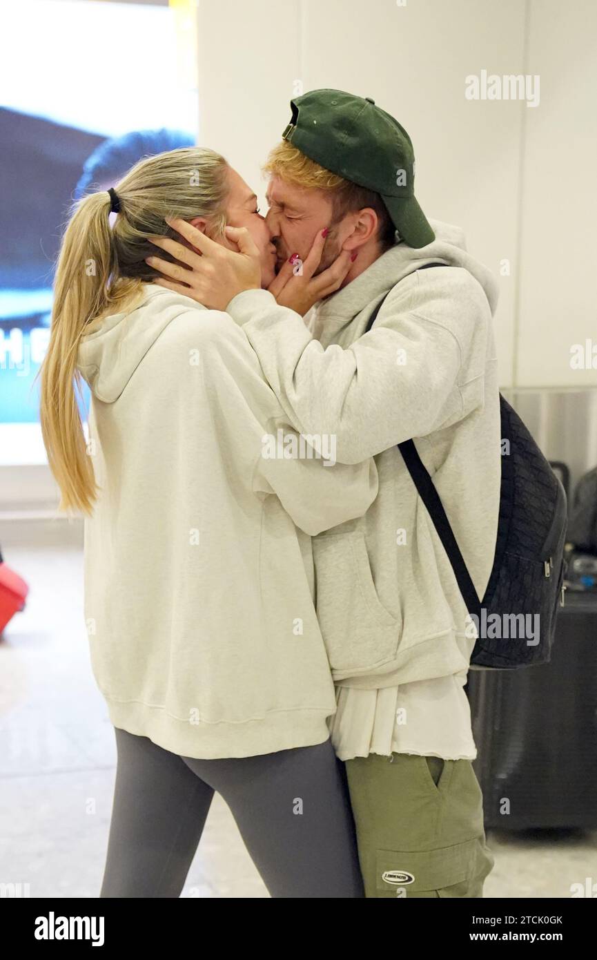 Series winner Sam Thompson (left) is greeted by Zara McDermott at ...