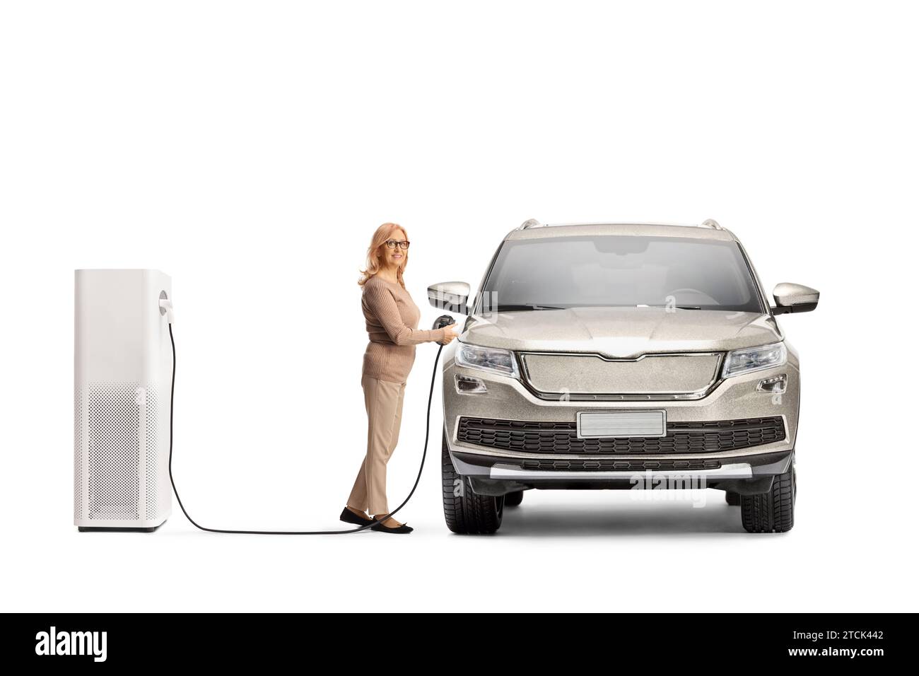 Woman charging an electric SUV at a charging point isolated on white ...