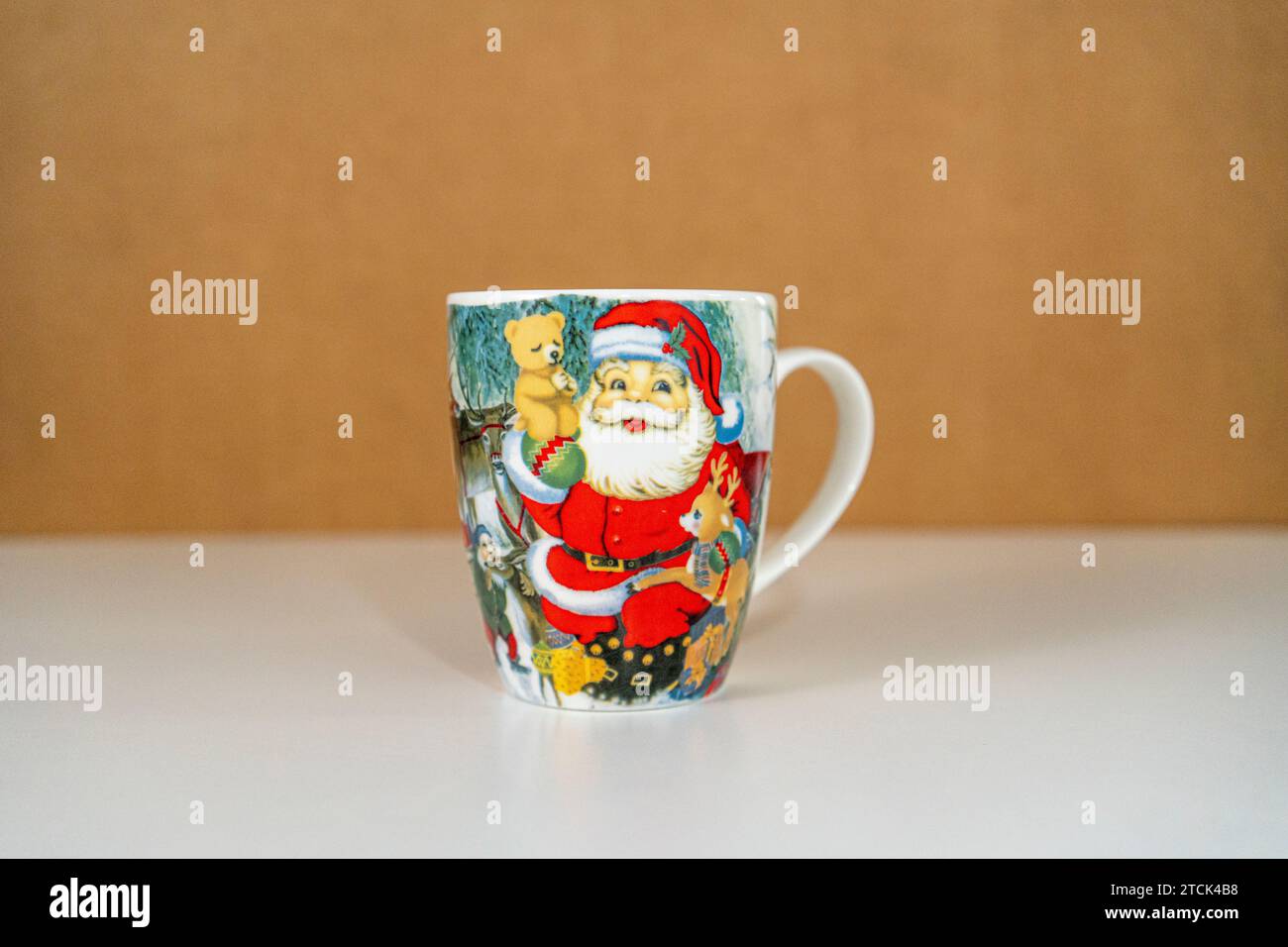 Christmas cup with Santa Claus and teddybear Stock Photo - Alamy