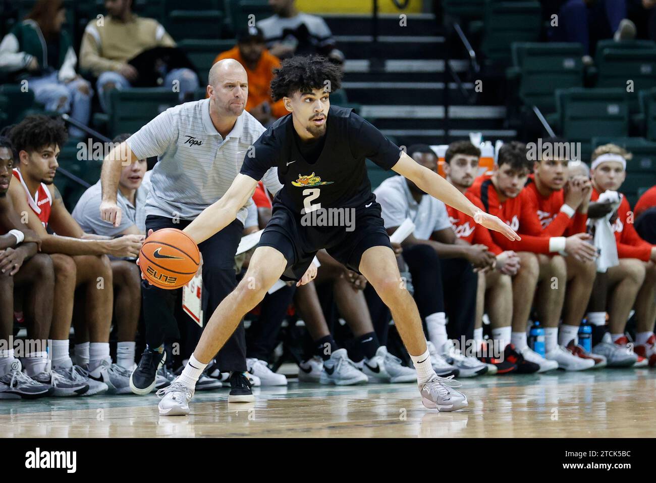Dayton, USA. 12th Dec, 2023. Drey Carter (2) saves the ball from going ...