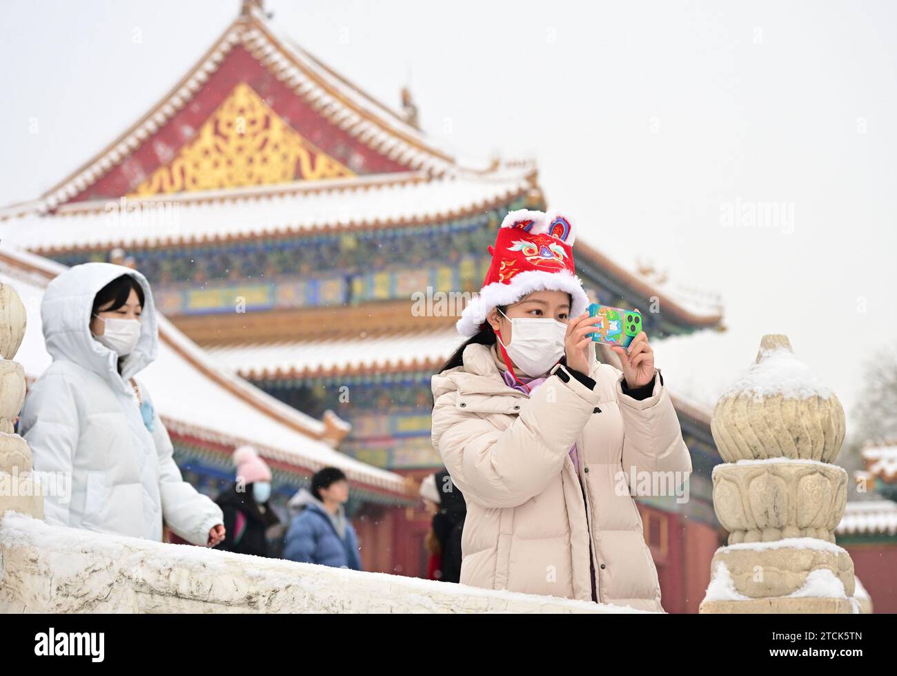 Beijing, China. 13th Dec, 2023. Tourists visit the Palace Museum in ...