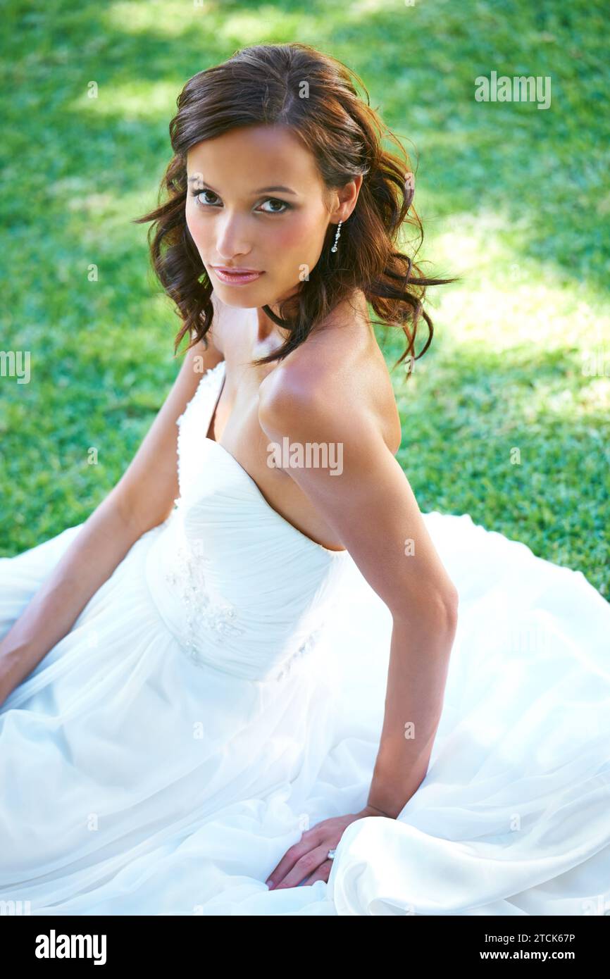 Portrait, fashion and woman in wedding dress in a garden for ...