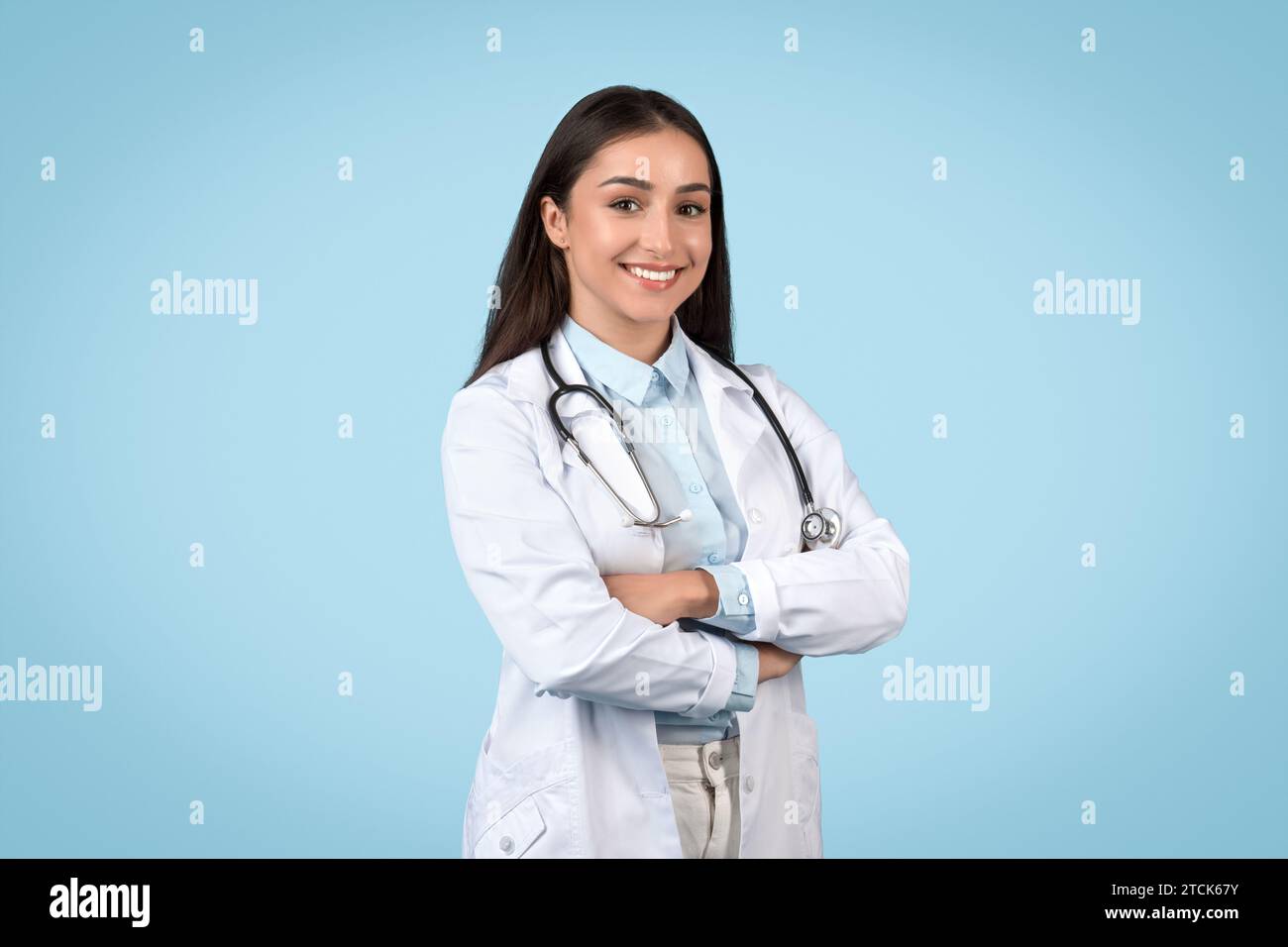 Cheerful doctor with stethoscope posing confidently Stock Photo - Alamy