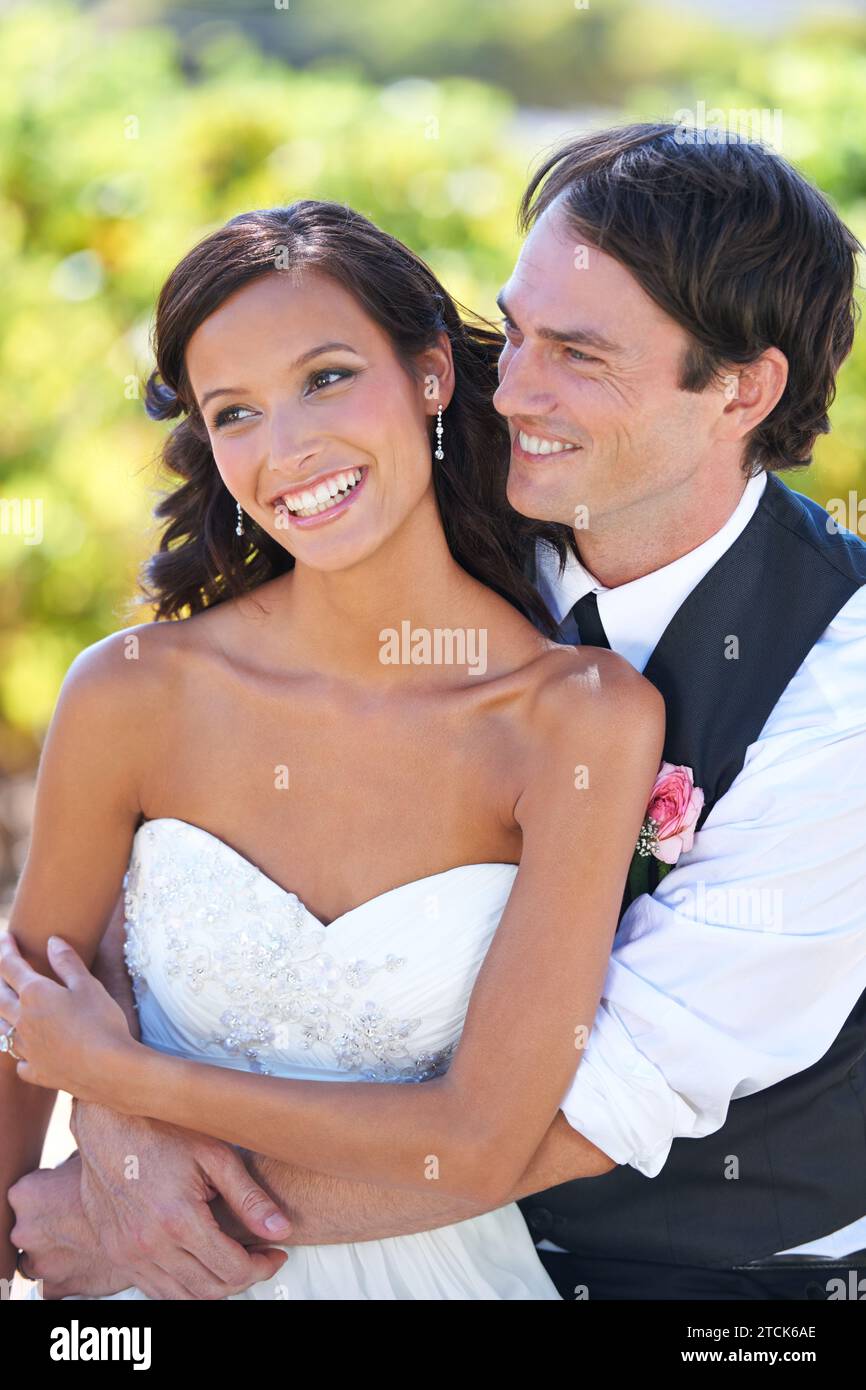 Love, happy couple hug at wedding and marriage in nature together ...