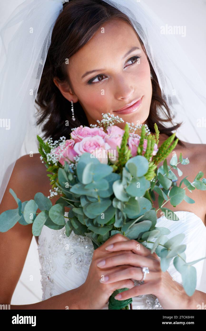 Bride woman, bouquet and flowers at wedding with thinking, pride and ...