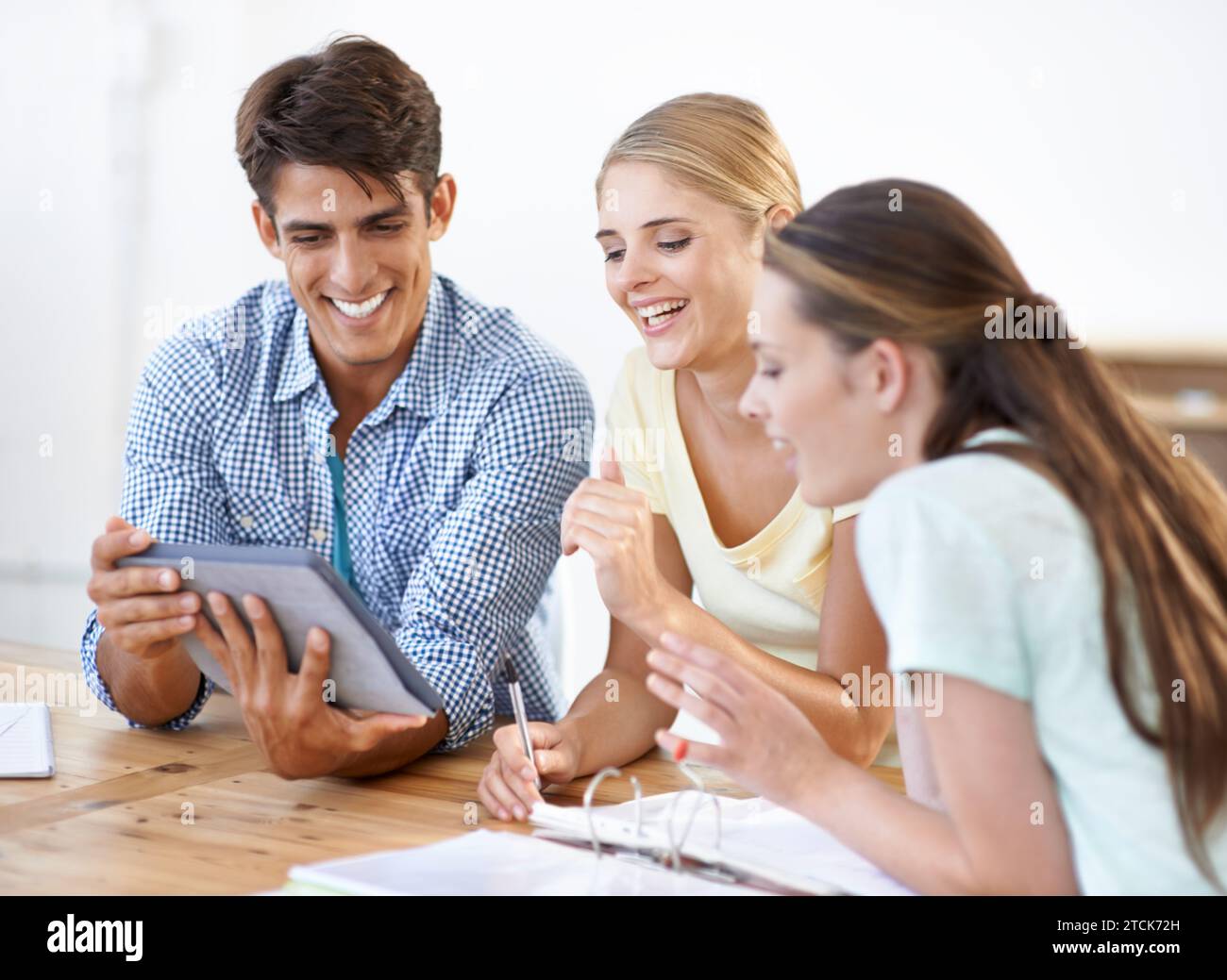 Teamwork, tablet or designers planning in meeting for documents or paperwork together in office ...