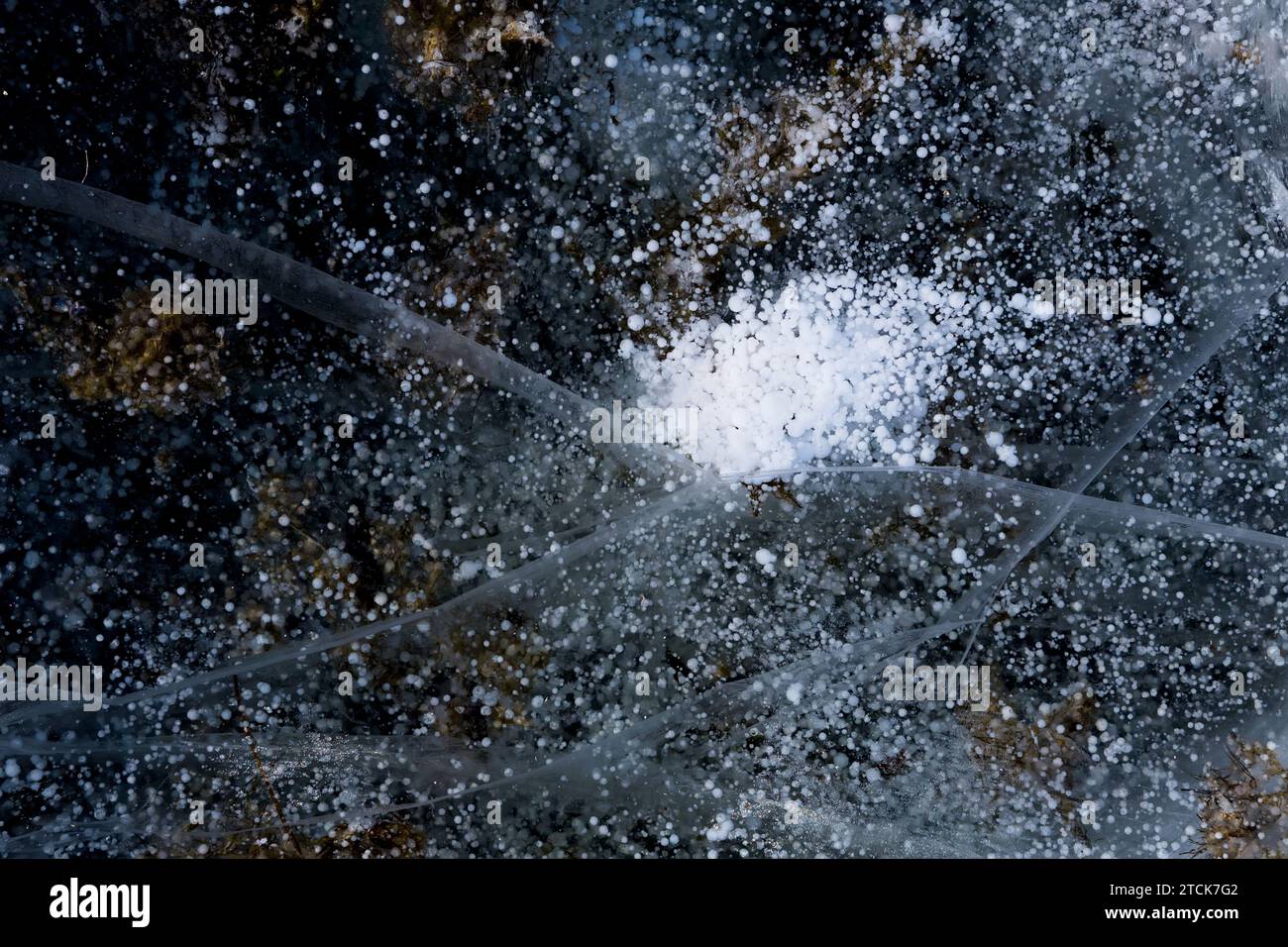 Group of methane bubbles creates shape like a space comet. Natural ice ...