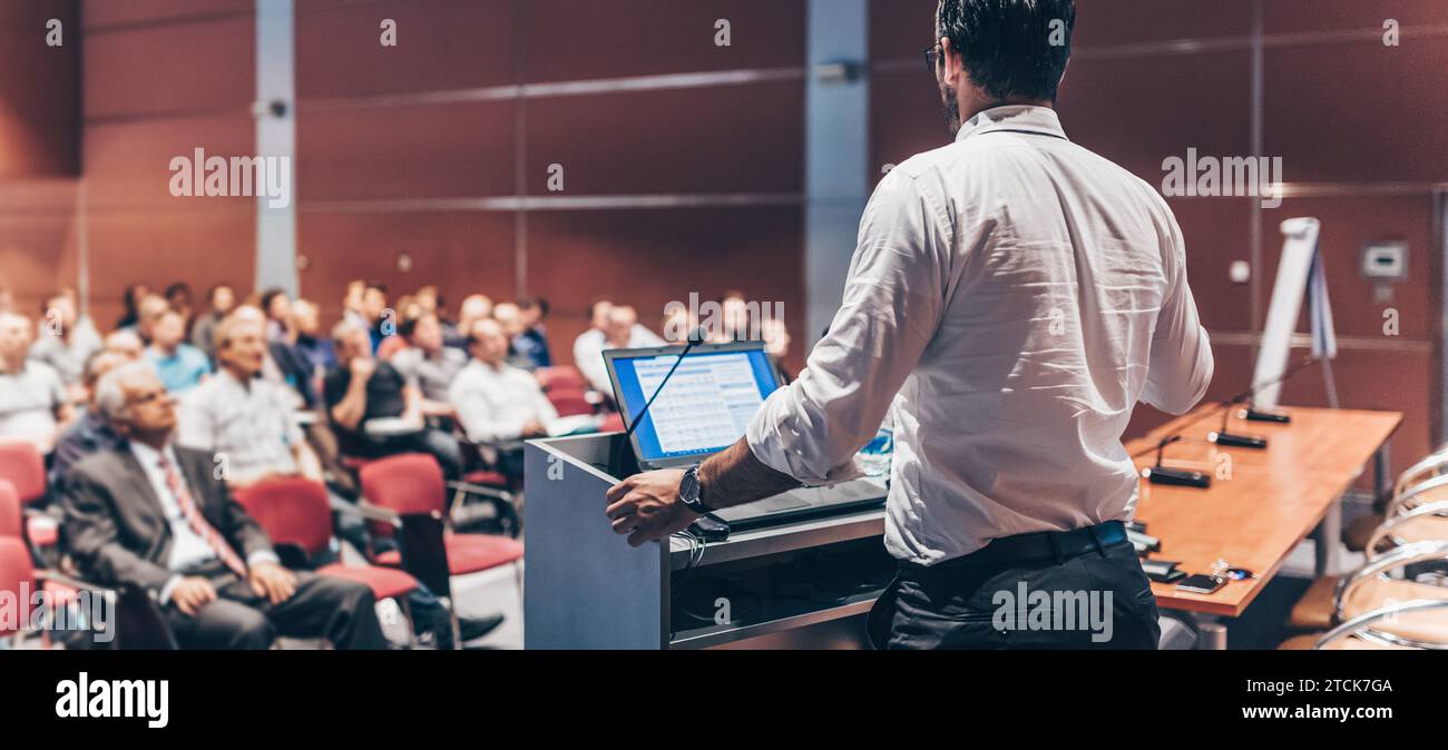 Speaker giving a talk on corporate Business Conference. Audience at the ...