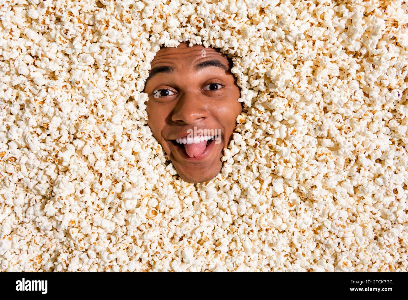 Photo of positive funny guy have spend free time weekend watch tv ...